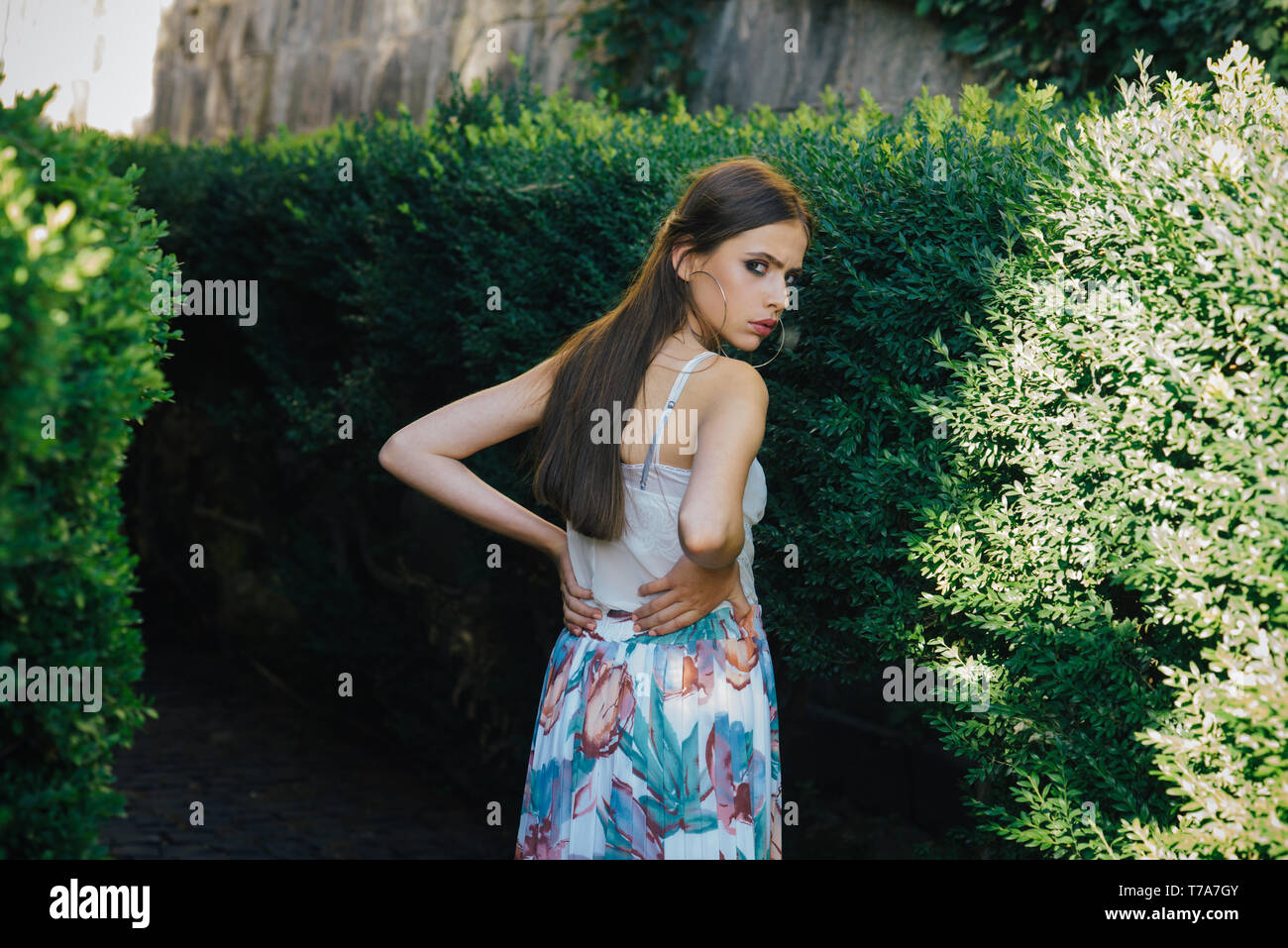 Beauty model in summer garden Stock Photo - Alamy