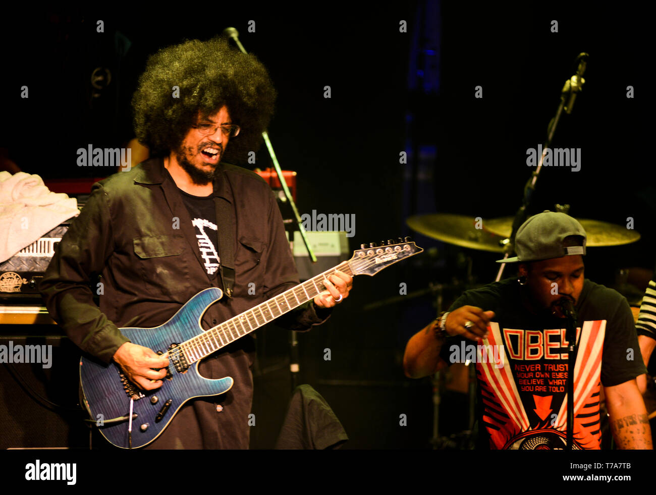 Guitar player Rocky George with Fisbone, alongside trombone player Jay ...