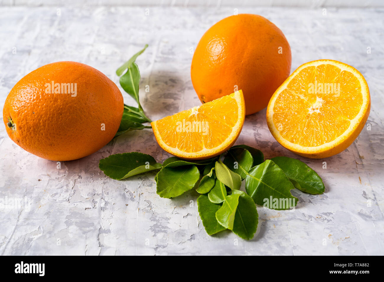Healthy eating concept. Flat lay of raw fresh orange fruit on gray ...
