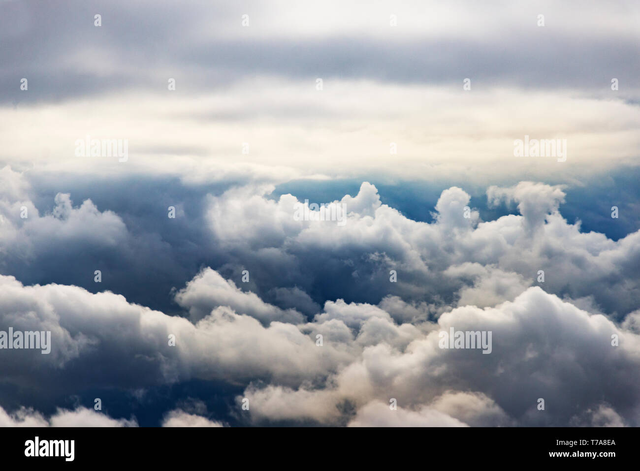 Clouds from a window of a commercial plane with sea Stock Photo - Alamy