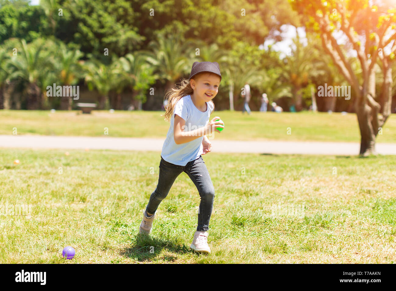 happy baby smiling. Little girl running in the park Stock Photo - Alamy