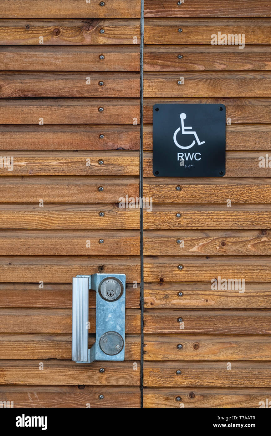 Sign of handicap toilet WC on wood background Stock Photo - Alamy