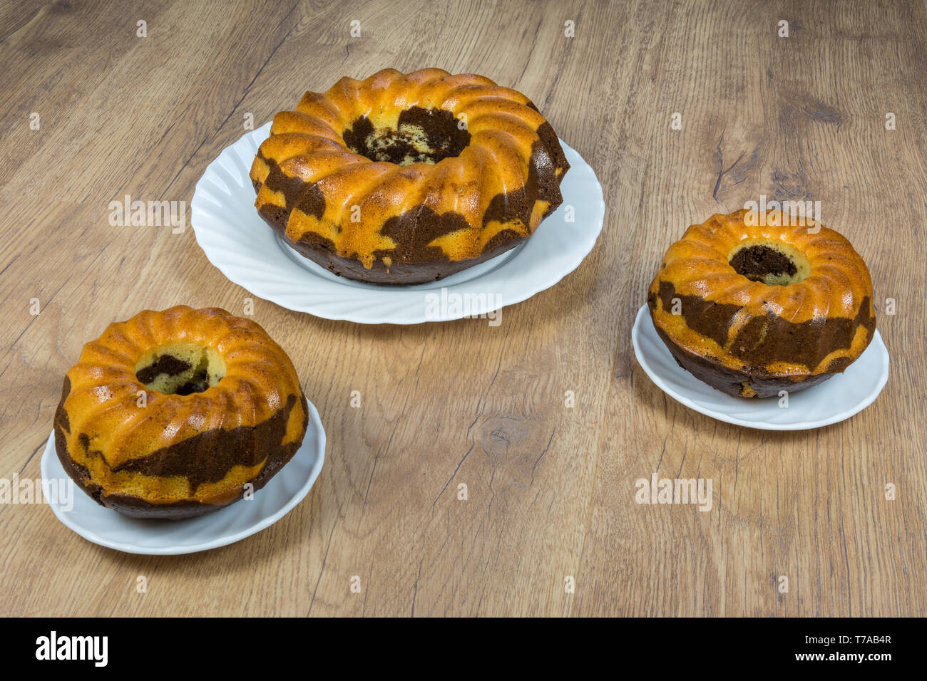 Sweet golden baked marble cakes. Sliced chocolate dessert on table ...