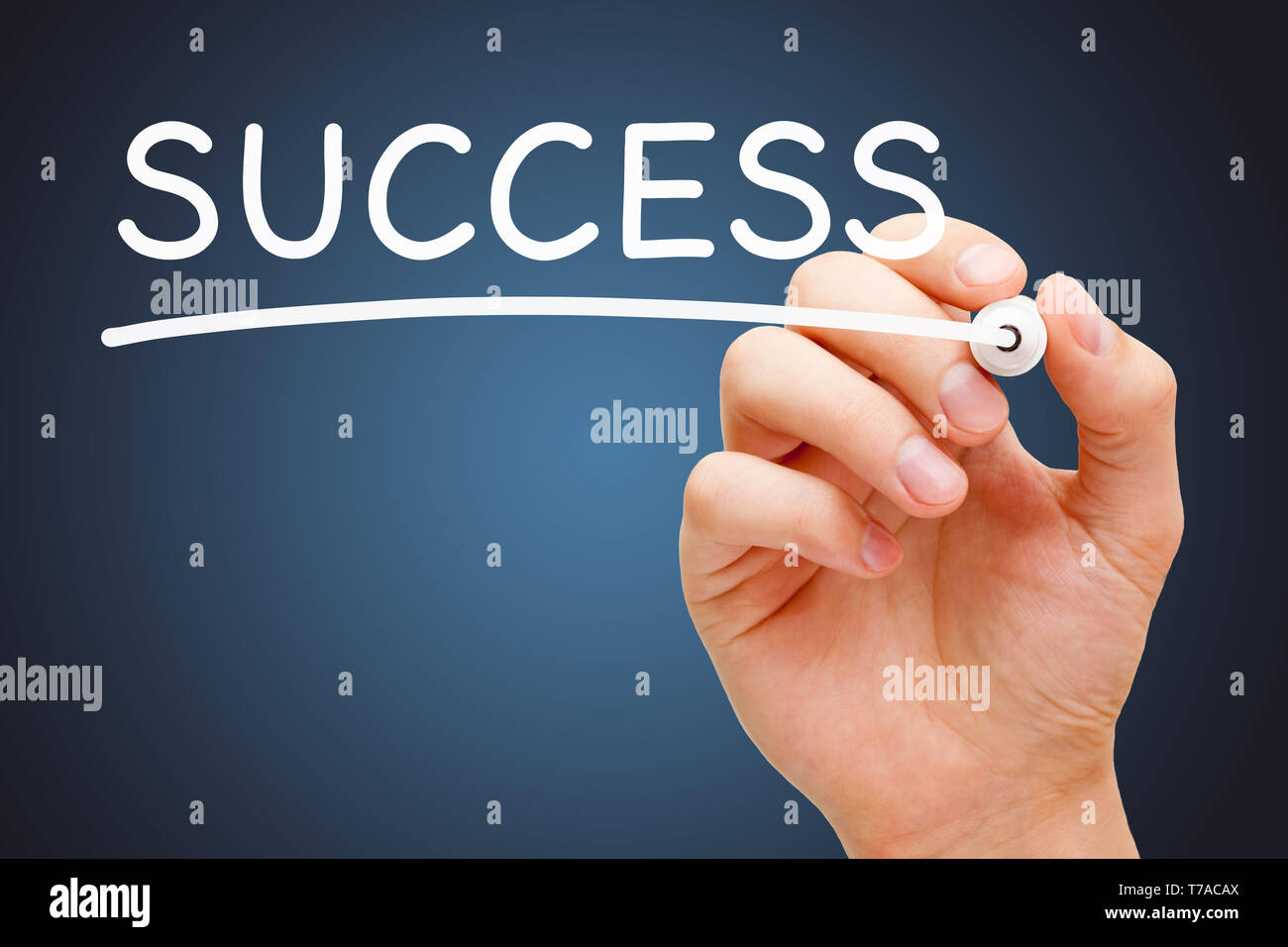 Hand writing the word Success with white marker on transparent wipe ...