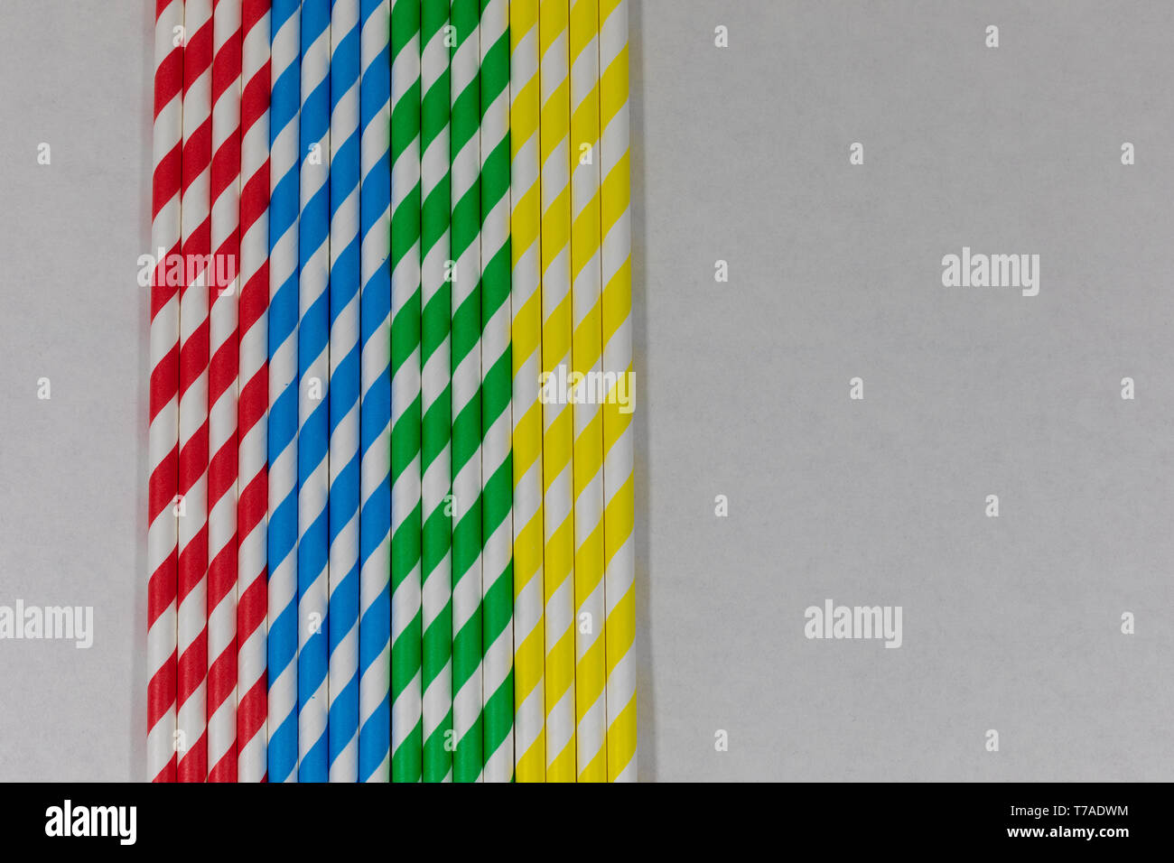 Flat lay of colourful paper straws, alternative to single use plastic ...