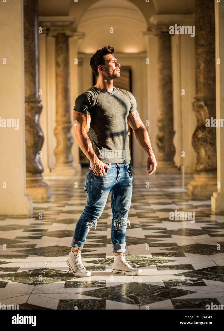 Handsome Man Looking Around Inside a Museum Stock Photo - Alamy