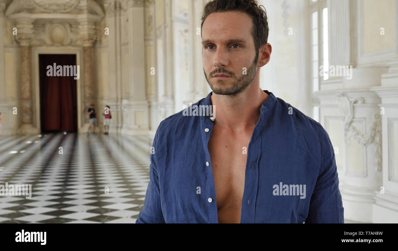 Handsome Man Looking Around Inside a Museum Stock Photo - Alamy