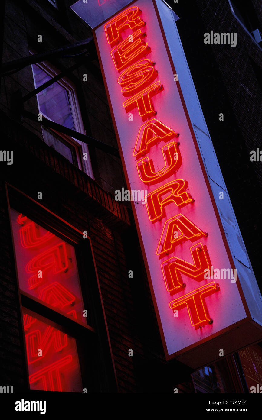 Bright red restaurant neon sign is reflecting in a window, New York ...