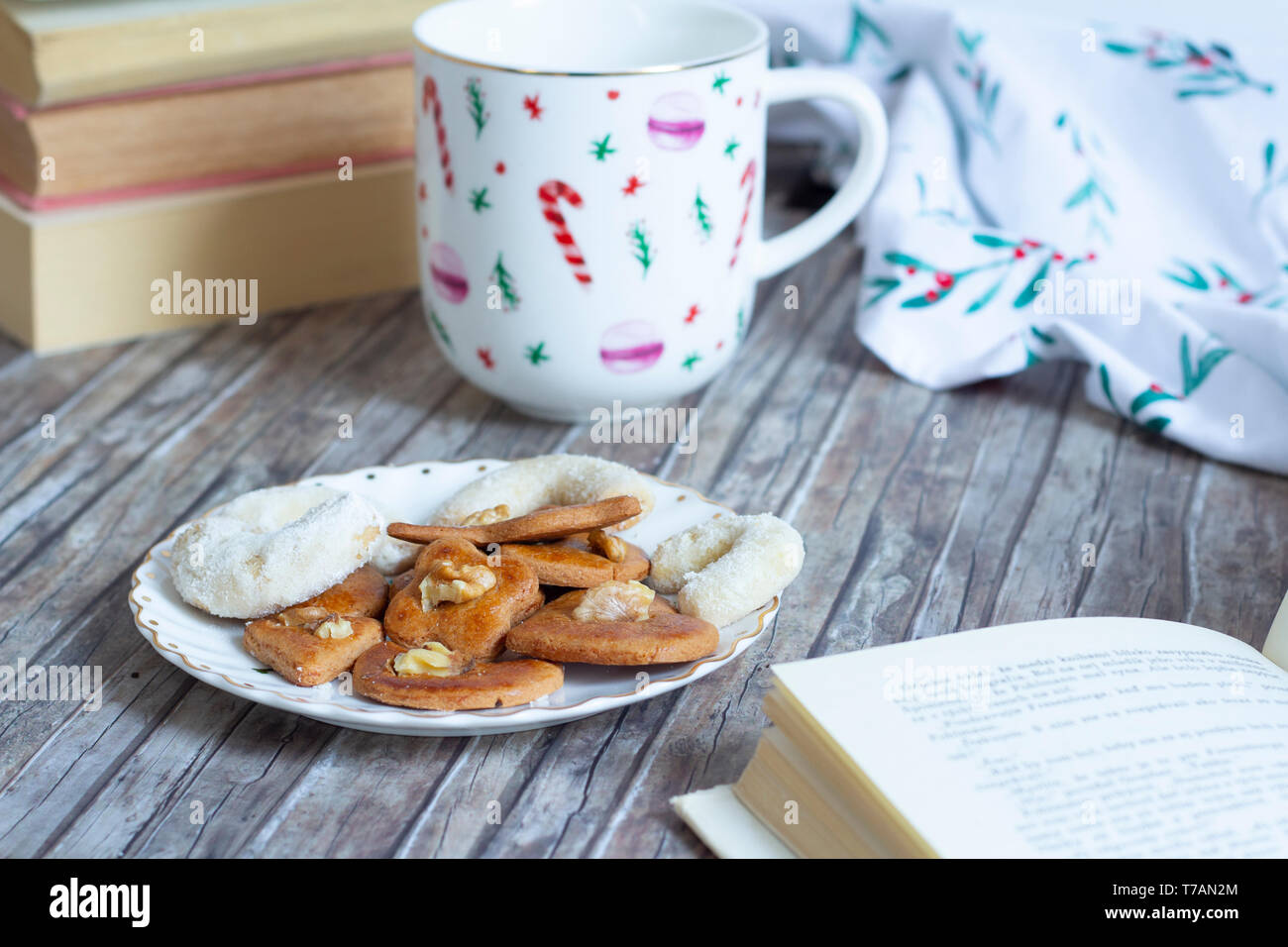 cup with tea, cakes and open book Stock Photo - Alamy