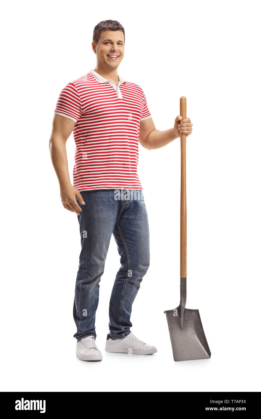 Full length portrait of a young handsome posing man with a shovel ...