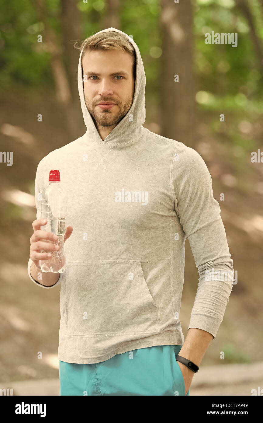 Refreshing vitamin drink after great workout. Man athletic appearance ...