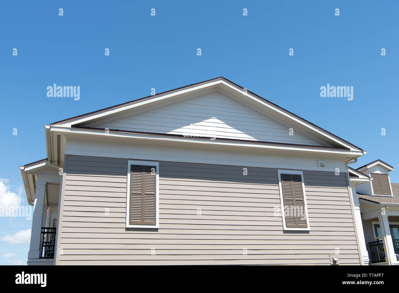 private territory. house on blue sunny sky. moving to new house. side ...