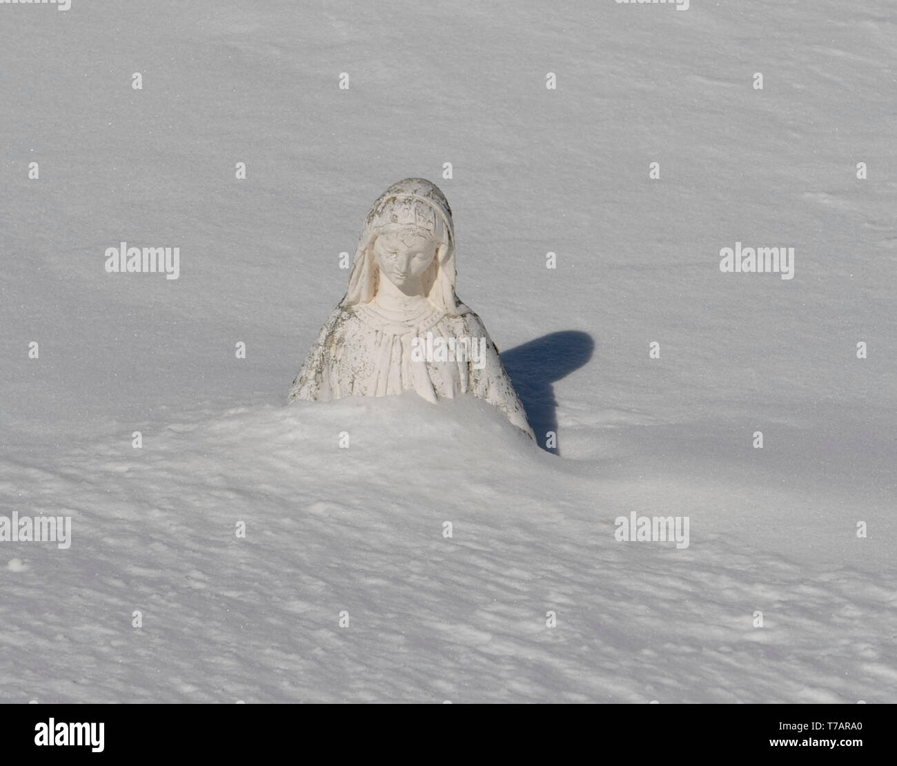 Virgin statue in the snow Stock Photo - Alamy