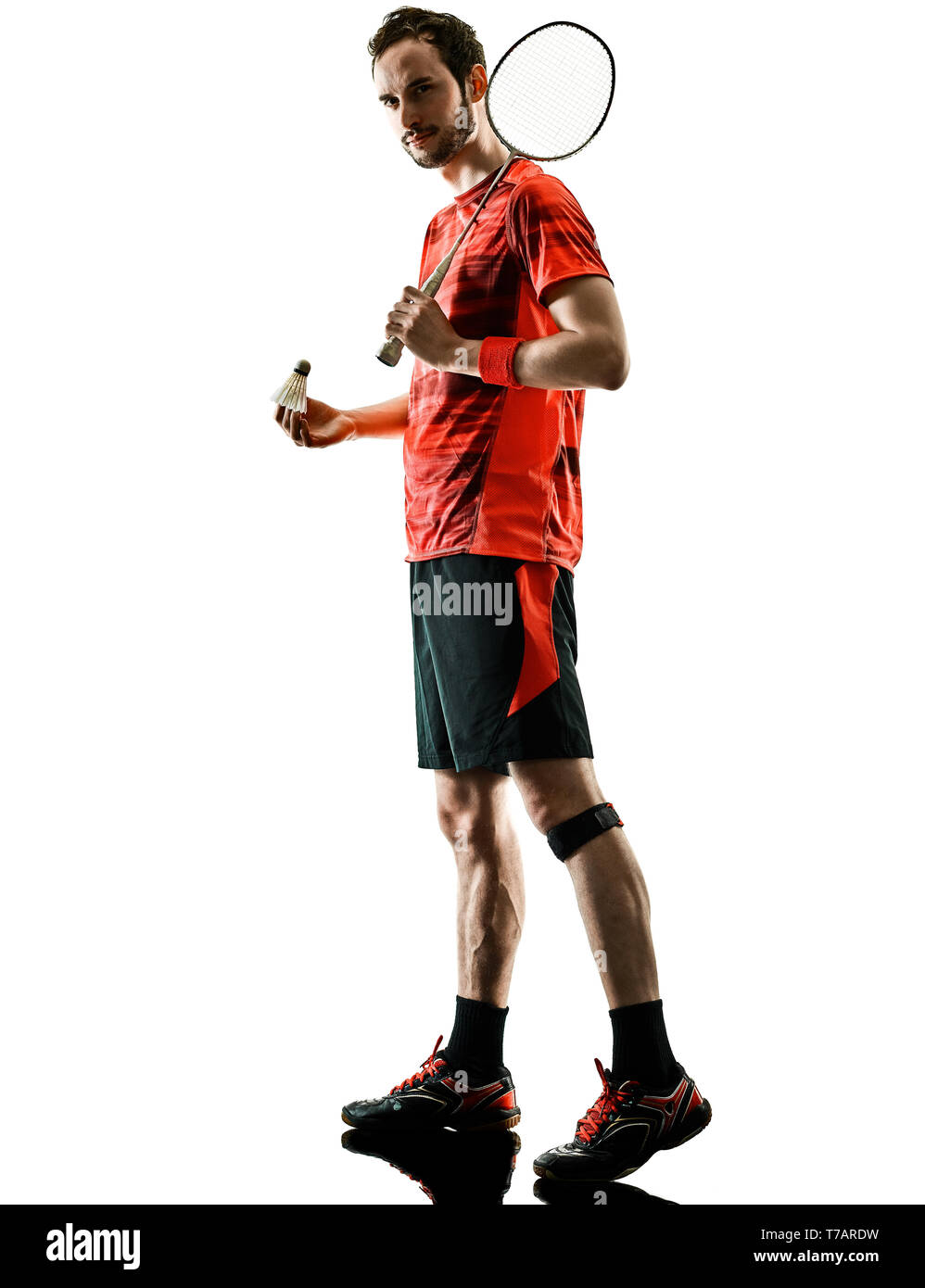 one caucasian Badminton player man in studio shadow silhouette isolated ...