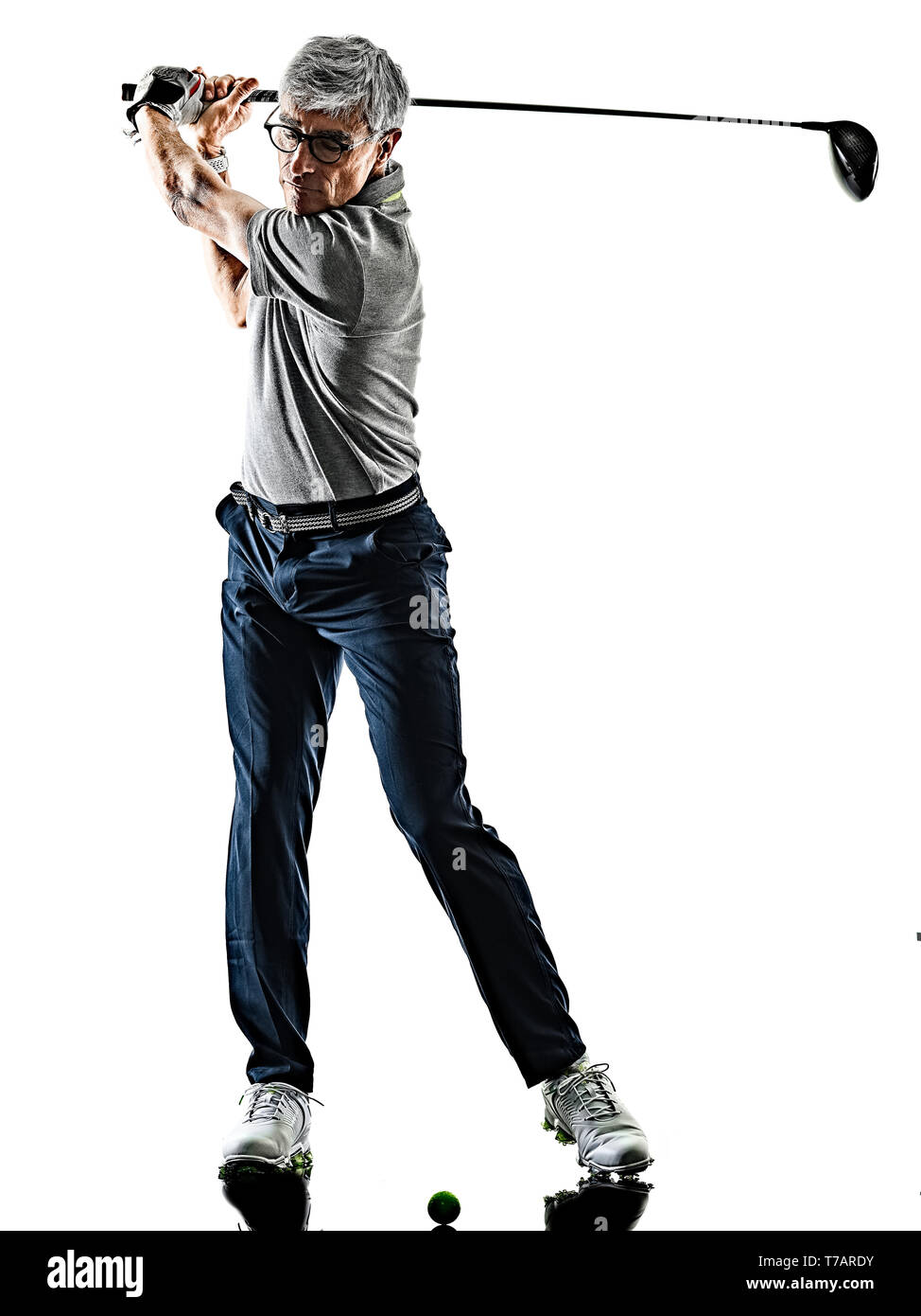 one caucasian senior man golfer golfing in studio shadow silhouette ...