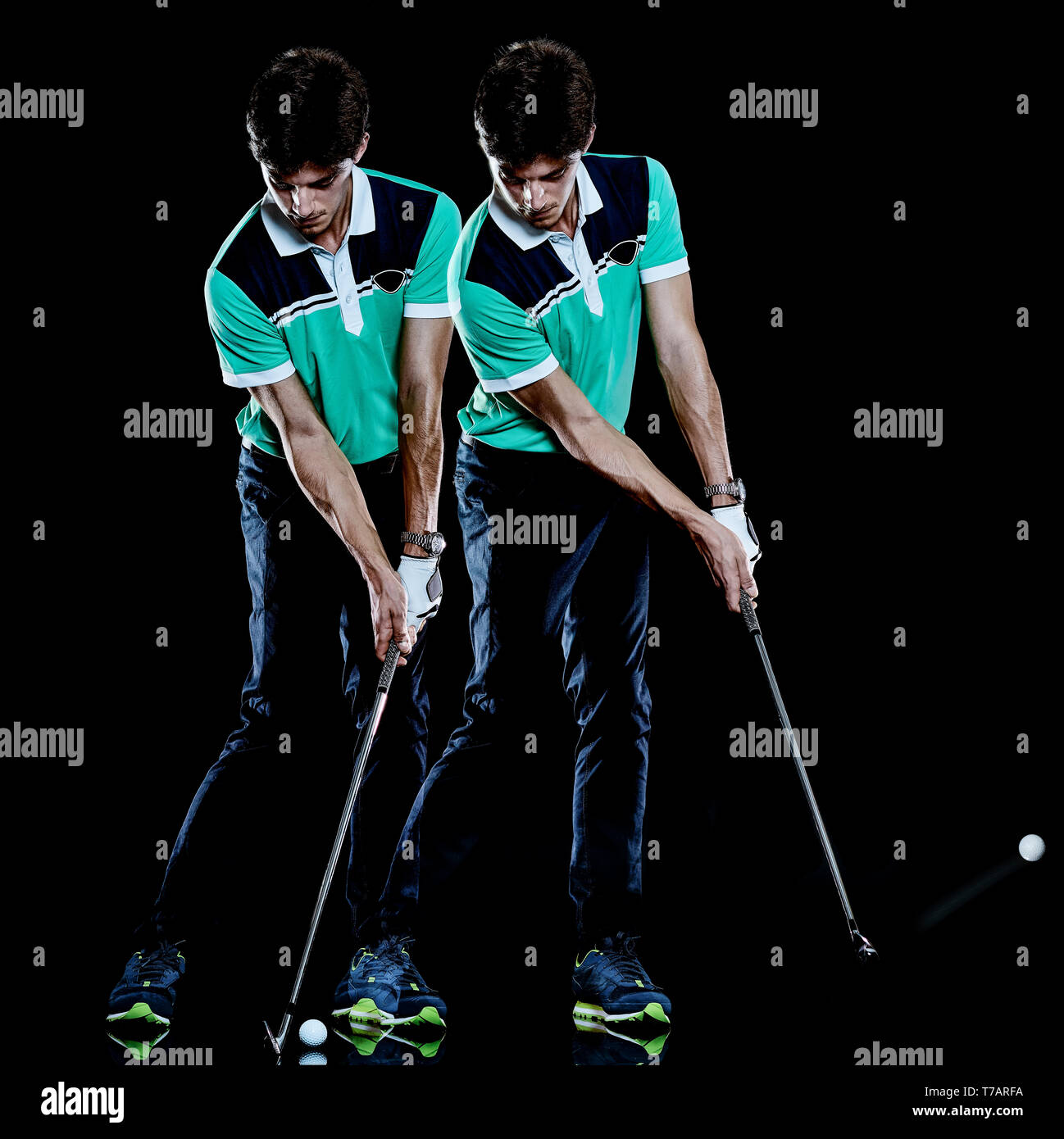 one caucasian young golfer man golfing golf swing isolated on black ...