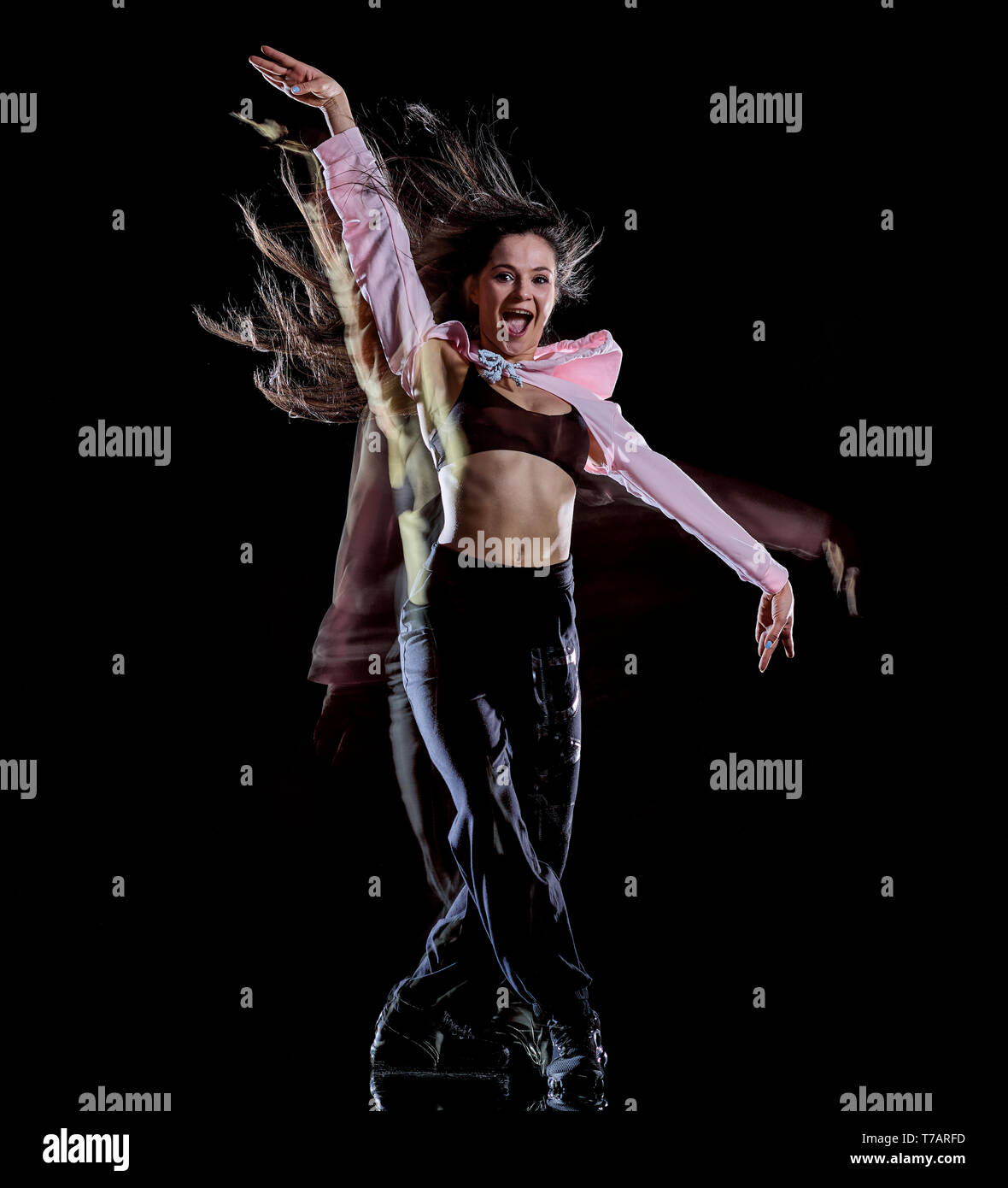 one caucasian young woman modern dancer dancing isolated on black ...