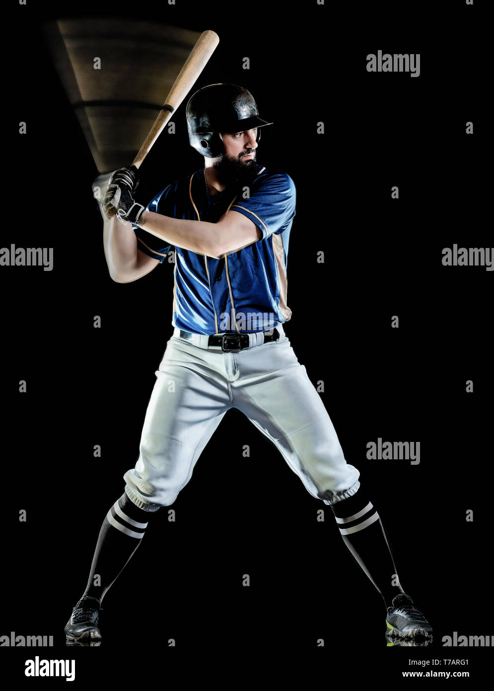 one caucasian baseball player man studio shot isolated on black ...