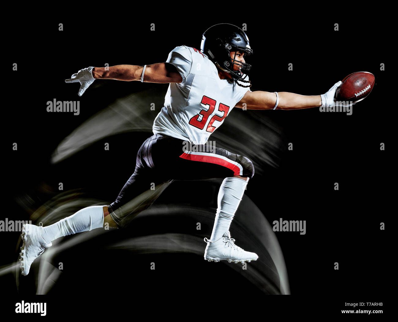 one african american football player man studio shot isolated on black ...