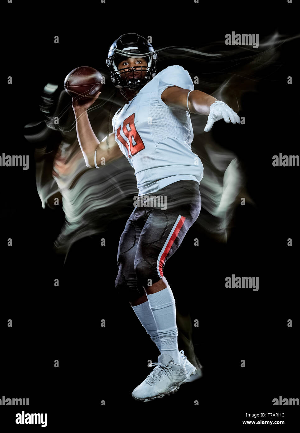 one african american football player man studio shot isolated on black ...