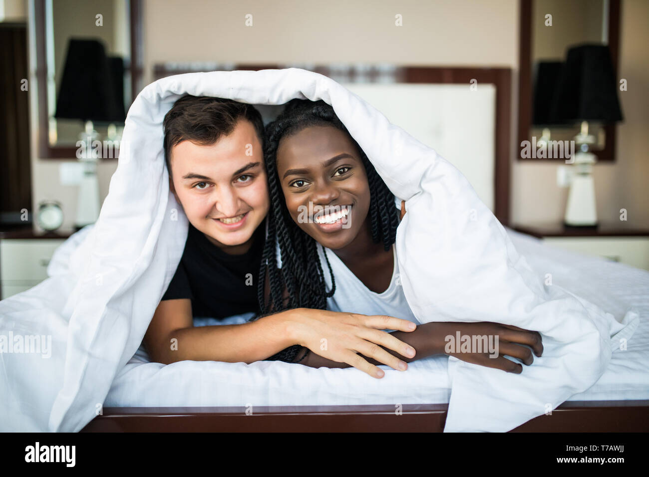 Girl sleeping under covers hi-res stock photography and images - Alamy