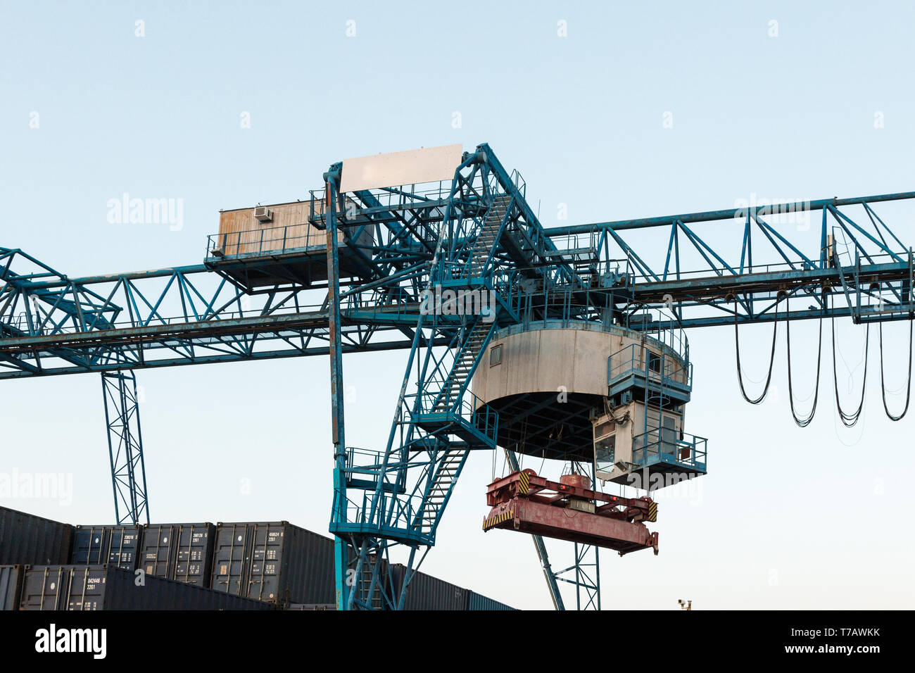 Large port crane unloads cargo containers Stock Photo - Alamy