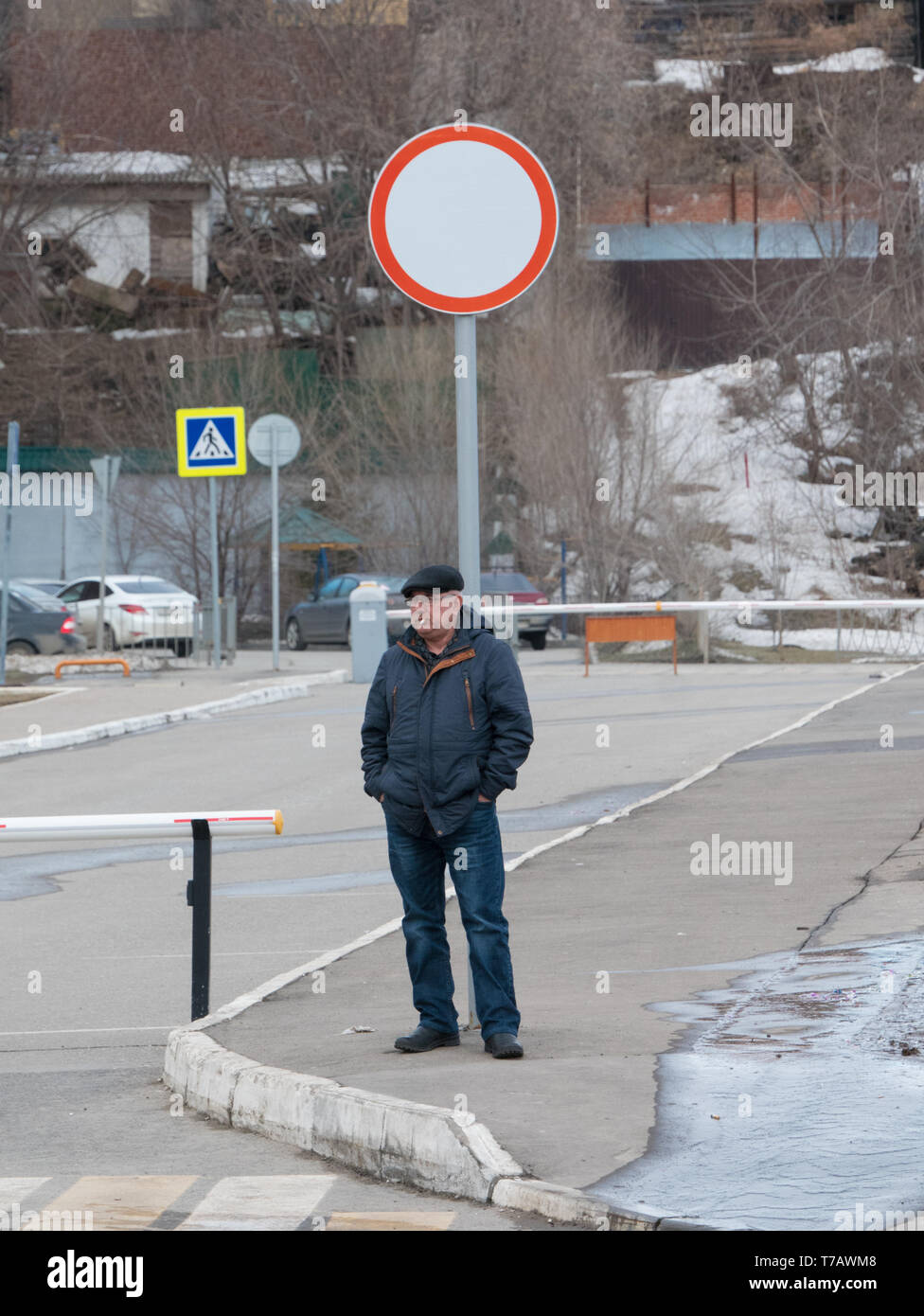 RUSSIA, KAZAN 10-04-2019: Urban streets. A typical russian man standing ...