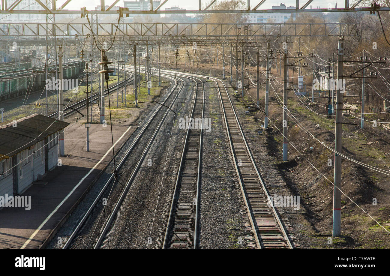 railways. two track rails leaving the distance and station Stock Photo ...