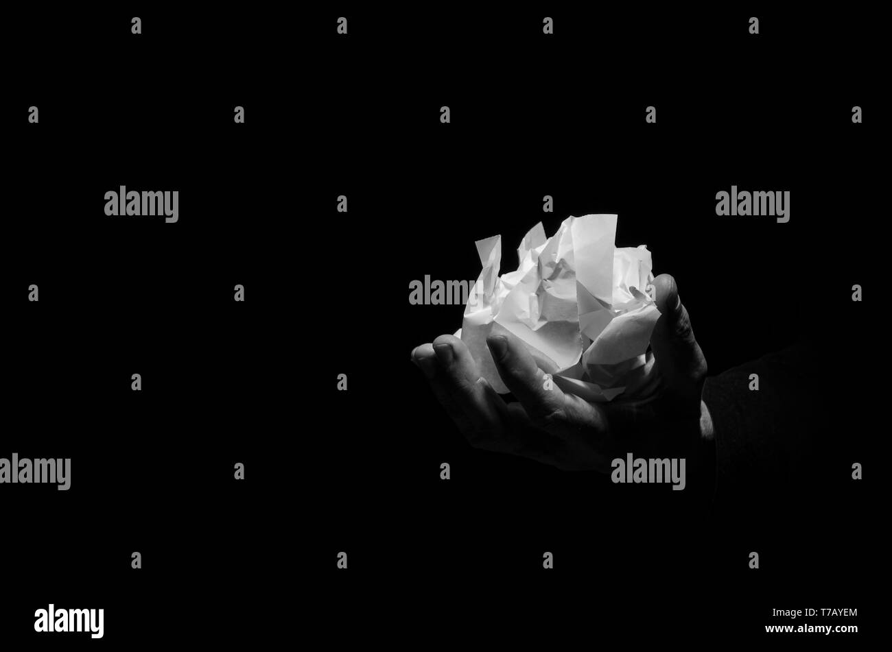 Hand holding crumpled sheet of paper hi-res stock photography and ...