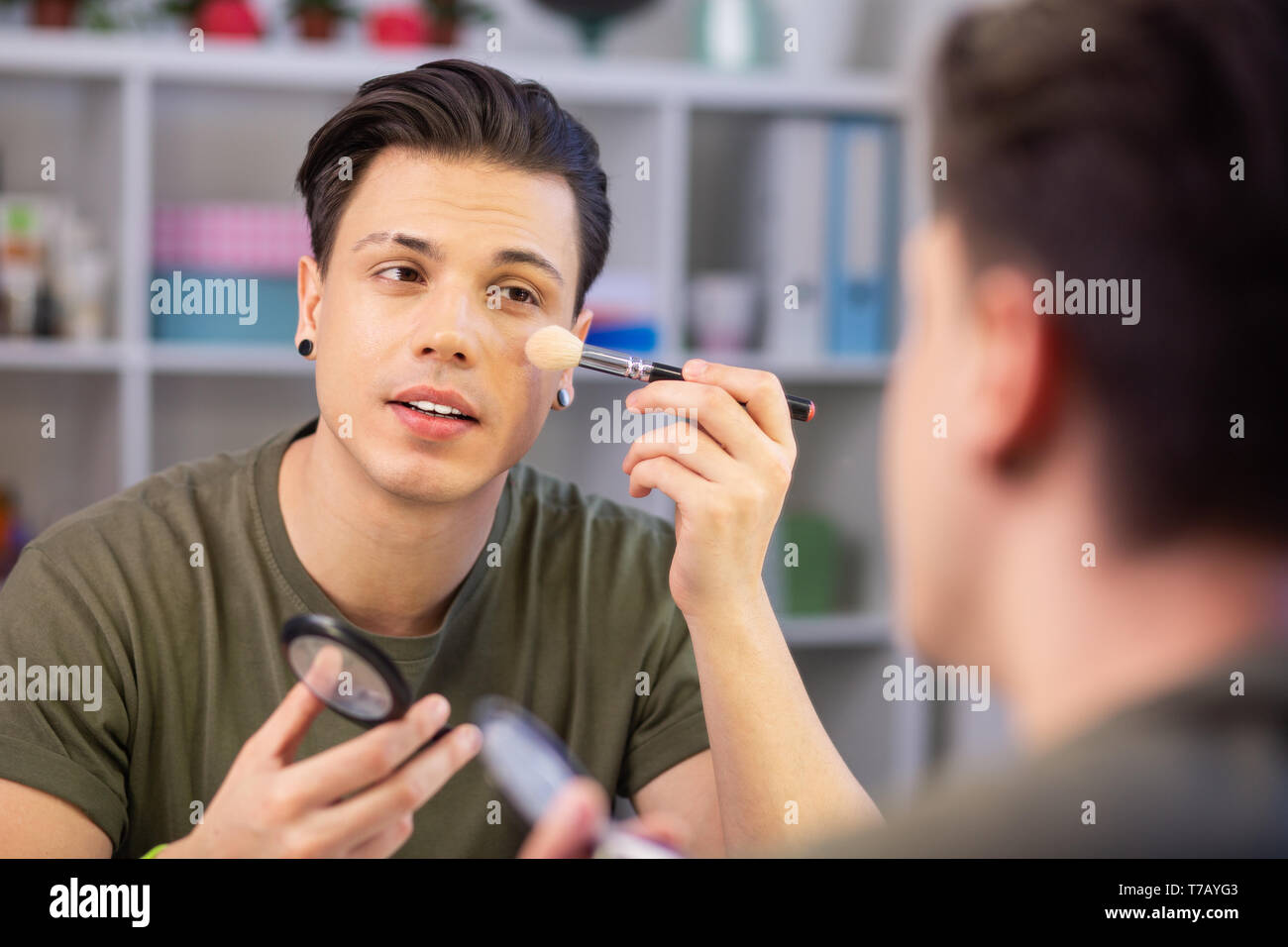 Stylish good-looking man having neat haircut while getting ready Stock ...