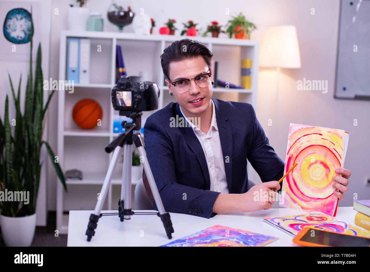 Active neat guy being an online motivational coach and talking to ...