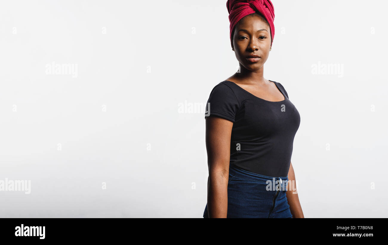 Side view of an african woman in jeans isolated on white background ...