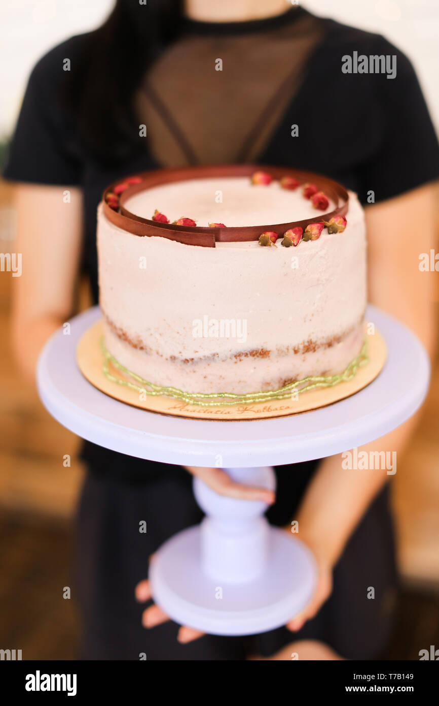 Woman keeping birthday cake with copy space Stock Photo - Alamy