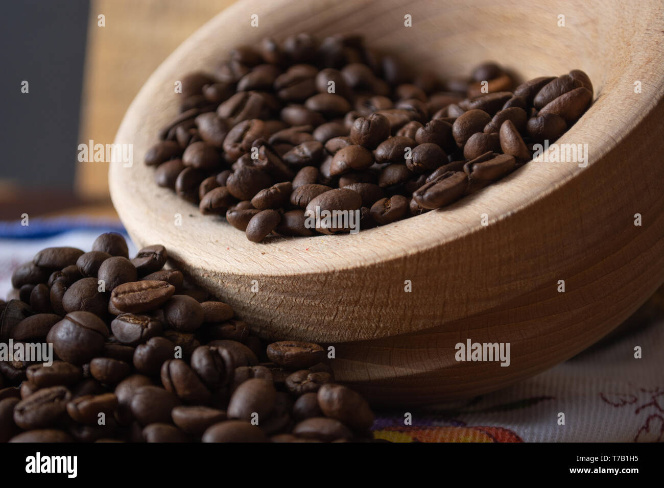 Coffee ready to be milled with old grinder. Coffee is in the table ...