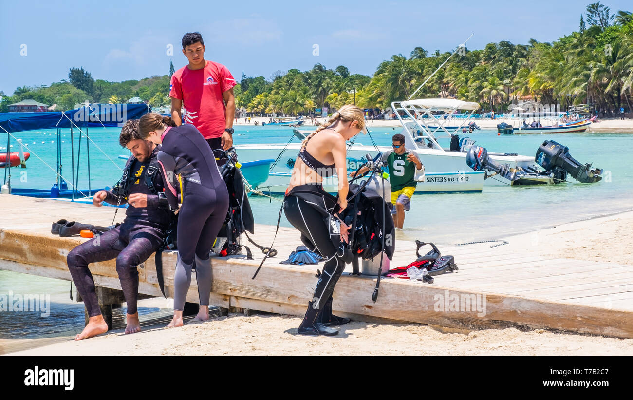 SUBA enthusiasts prepare to dive on the Mesoamerican Barrier Reef off West Bay Roatan Honduras ...