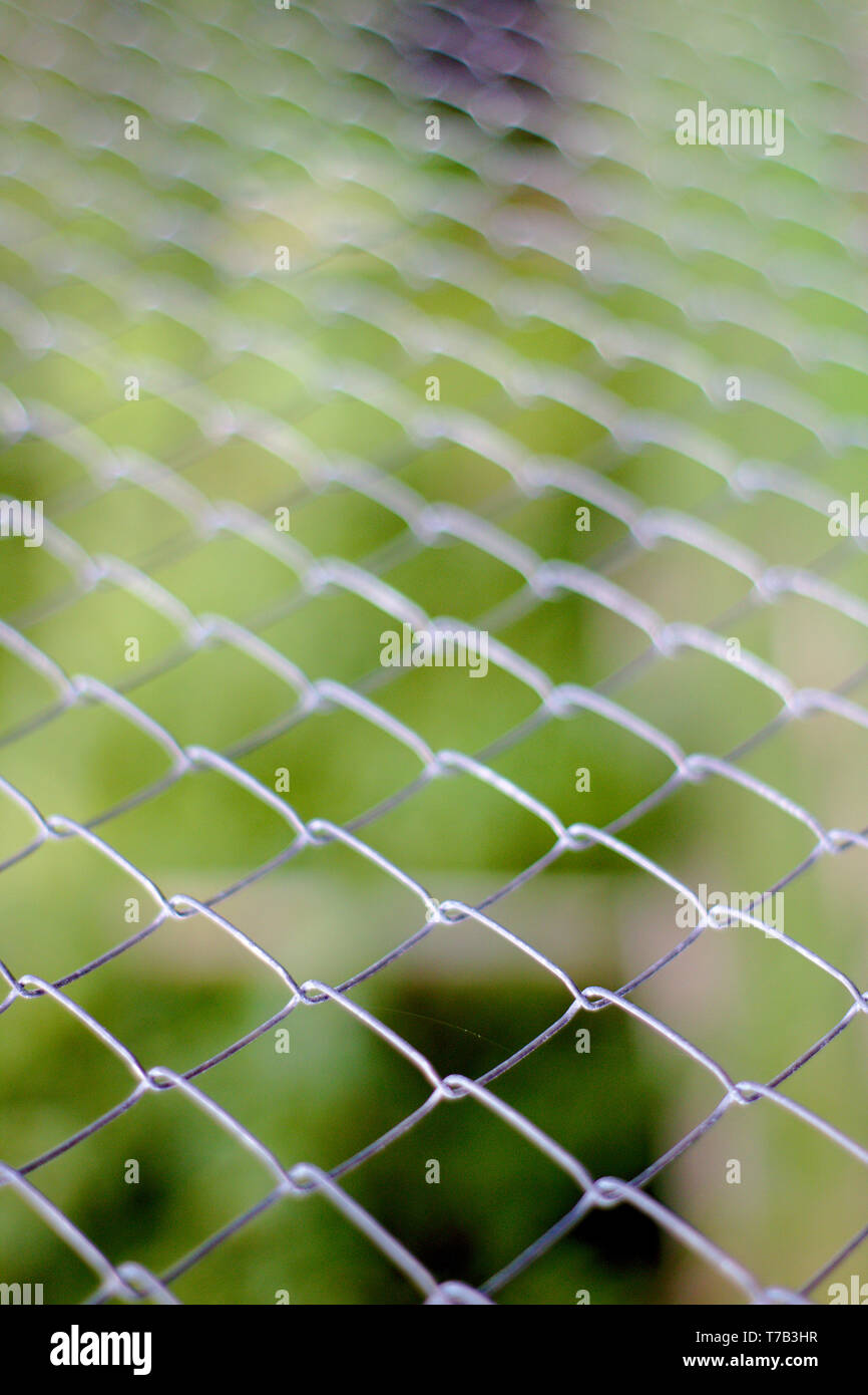 Abstract image of a mesh fence Stock Photo - Alamy