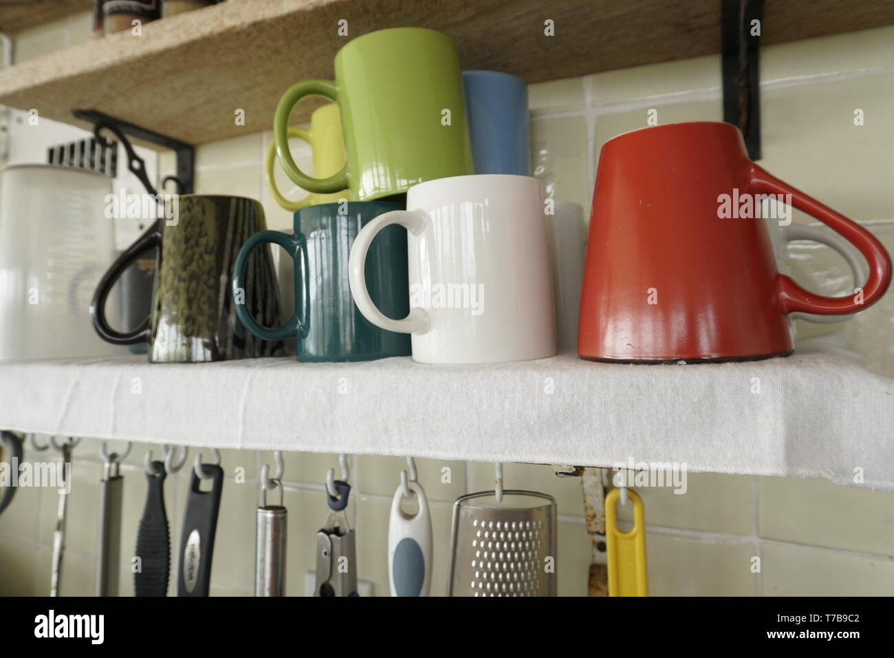 Coffee cups on shelf Stock Photo - Alamy