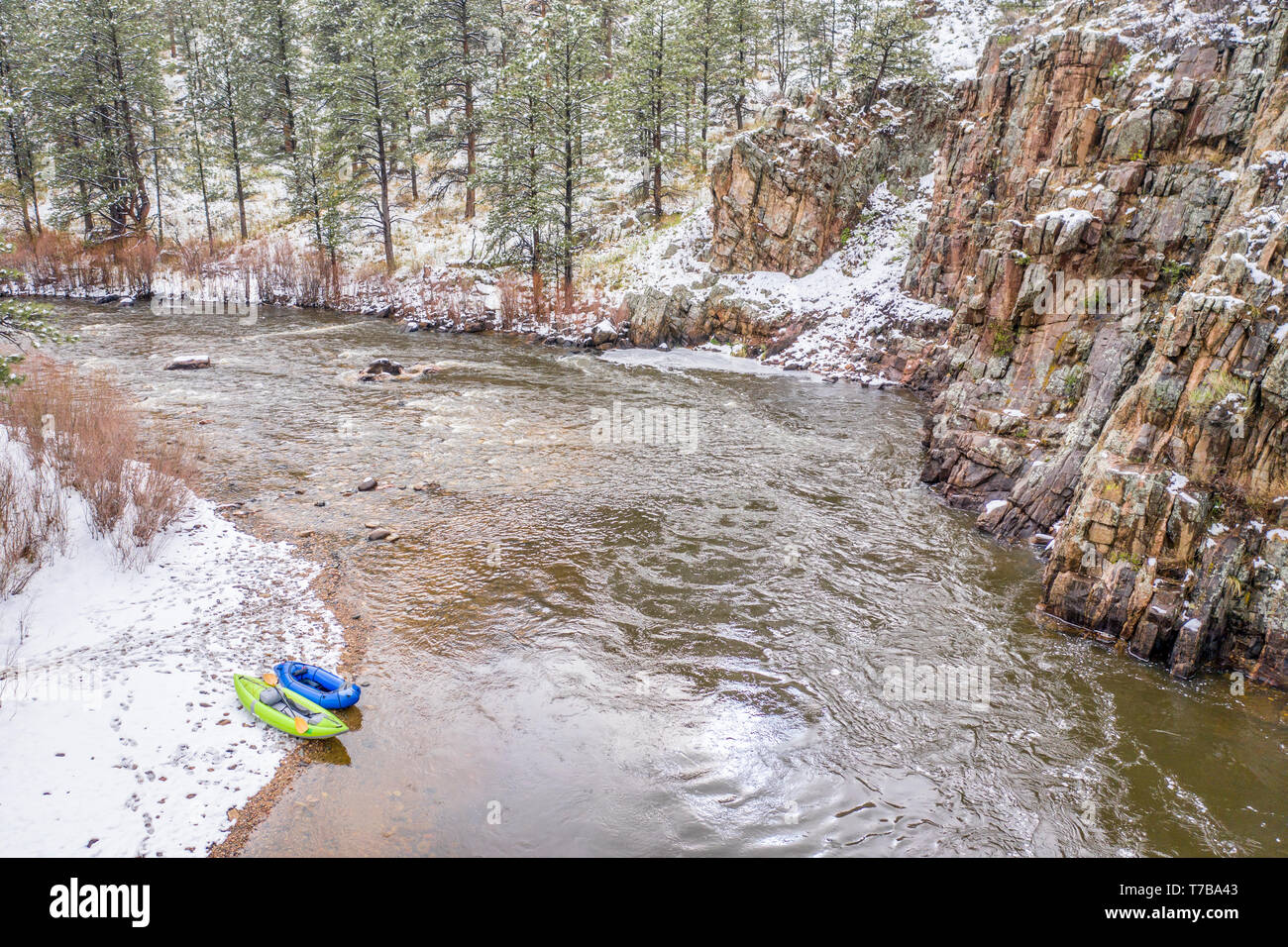 aerial view of inflatable whitewater kayak and packraft on a rocky ...
