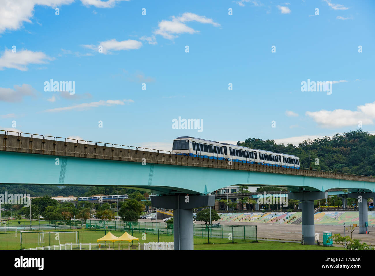 Morning view of the landscape, metro line with a metro pass by near ...