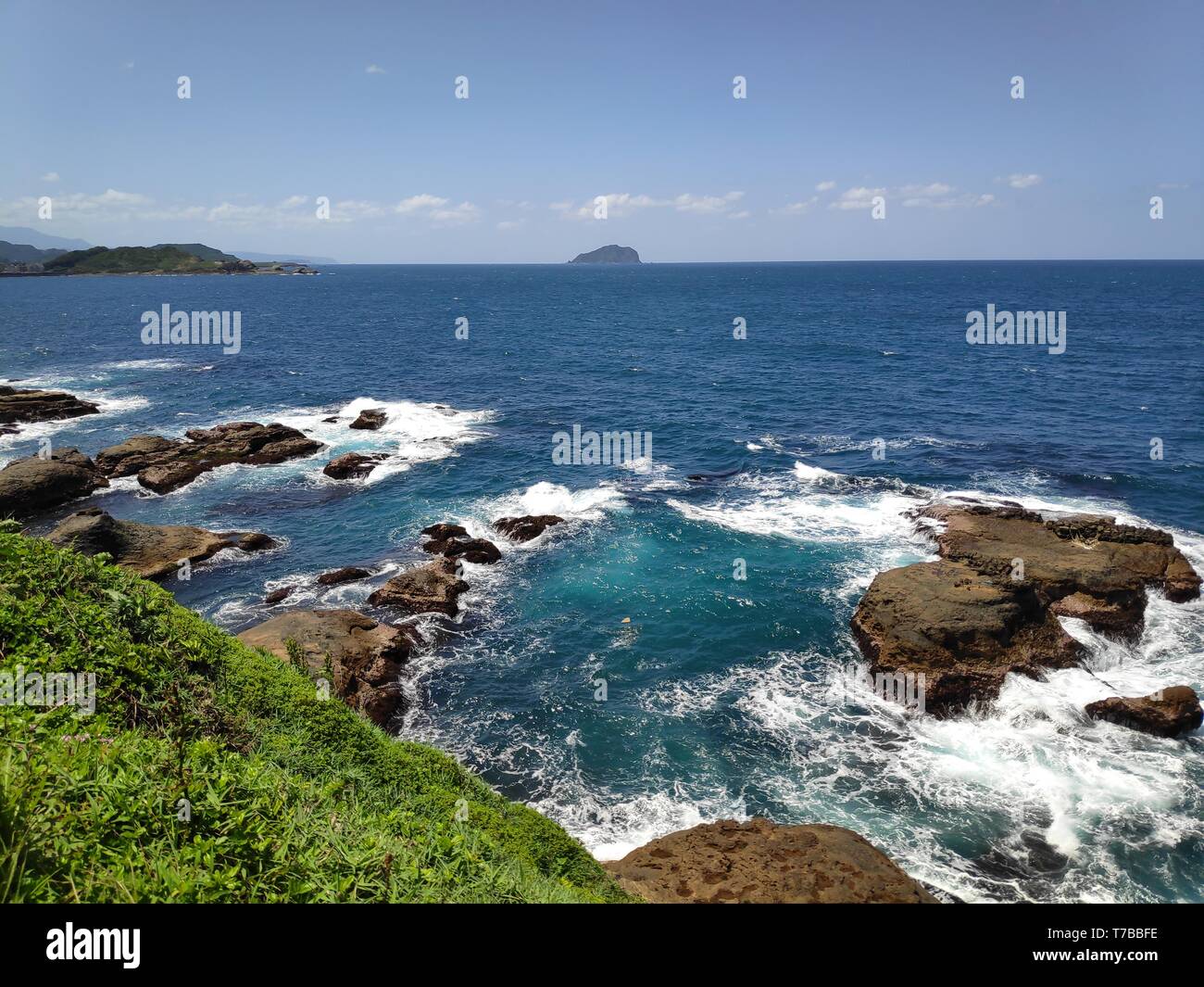 The beautiful beach with deep blue water and light blue sky and nice ...