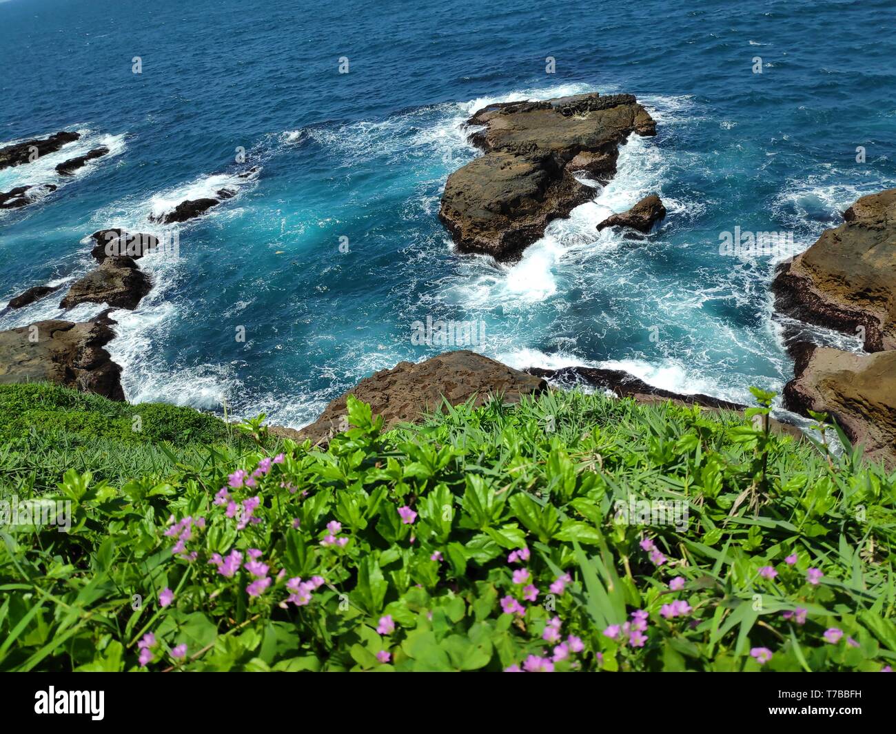 The beautiful beach with deep blue water and light blue sky and nice ...
