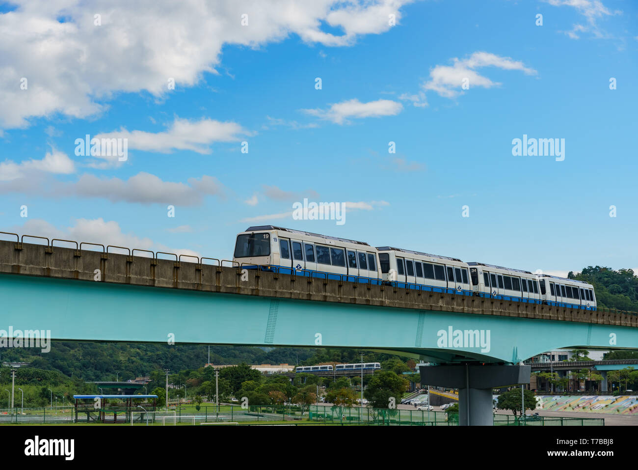Morning view of the landscape, metro line with a metro pass by near ...