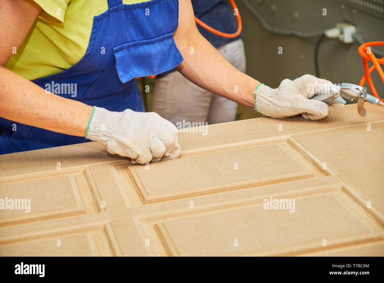 wood door milling, interior doors production 4k Stock Photo - Alamy