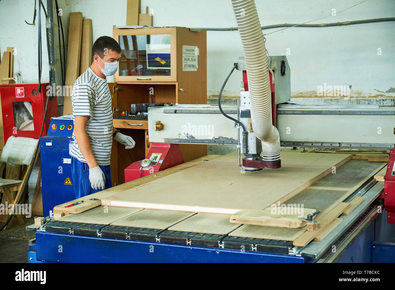 wood door milling, interior doors production 4k Stock Photo - Alamy