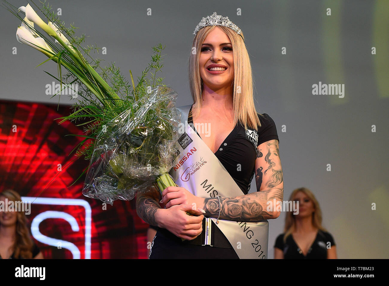 Vanessa Knauf, Miss Tuning 2019, seen with flowers during Tuning World ...