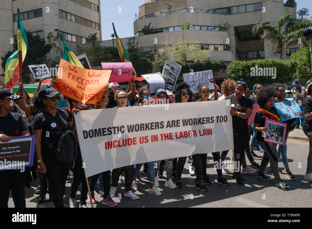 Protesters are seen holding a banner, flags and placards during the ...