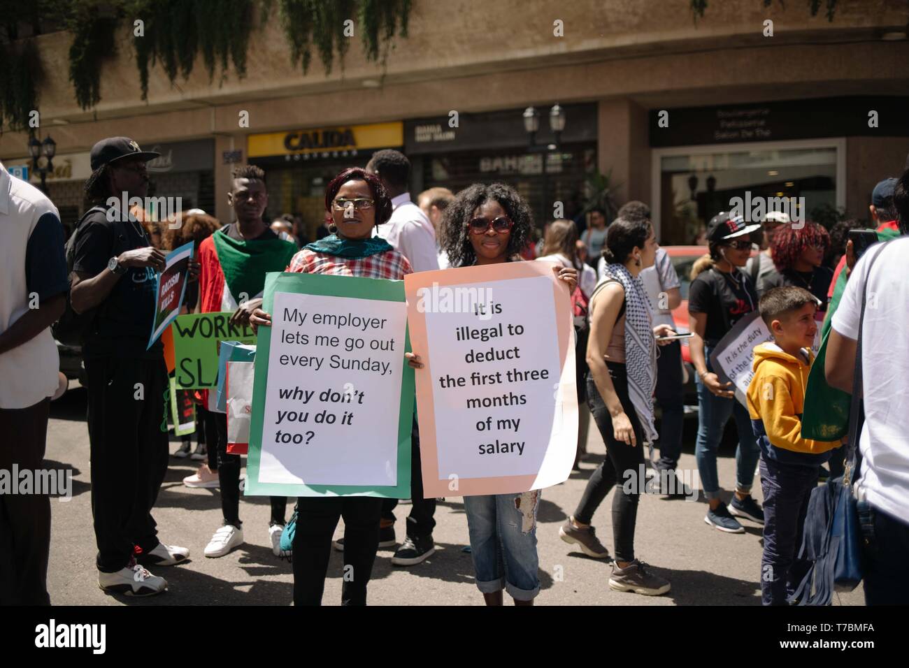 Protesters are seen holding placards during the demonstration. Hundreds ...