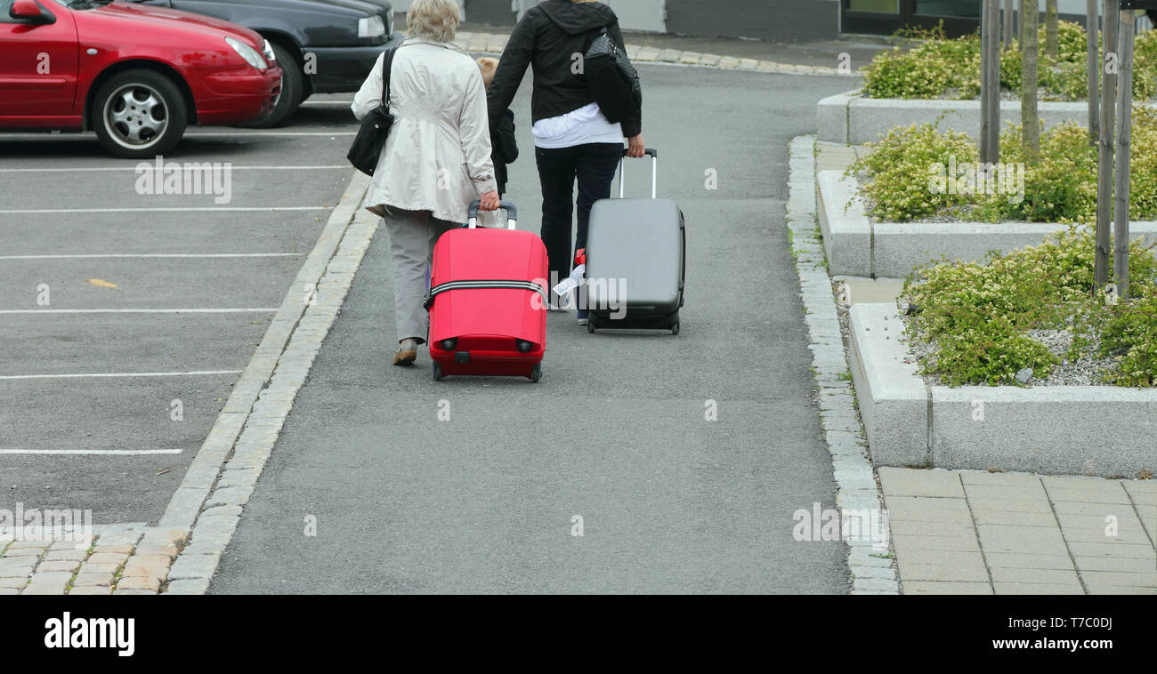 Family with baggage Stock Photo - Alamy
