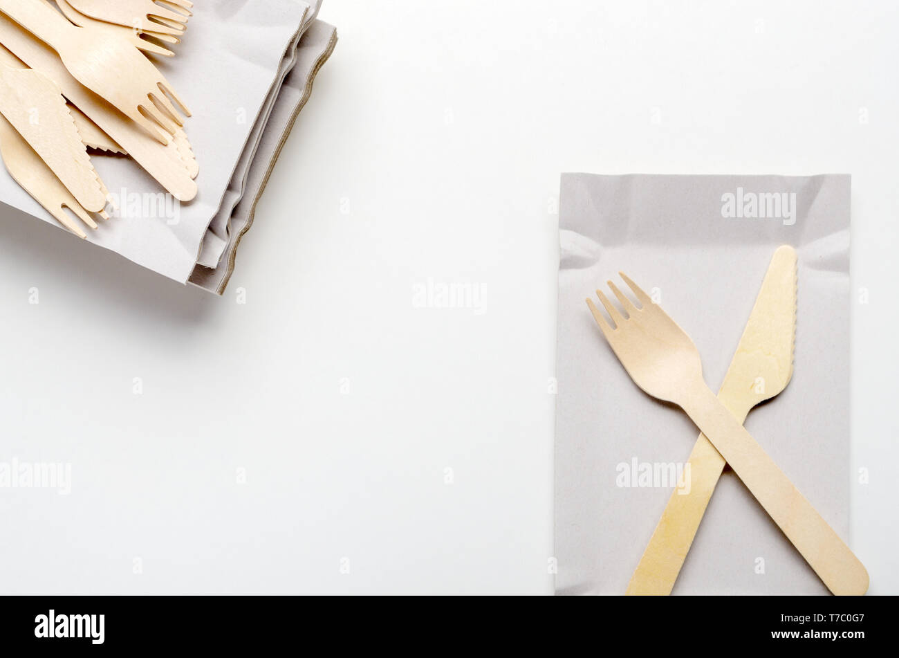 Wooden single use kitchenware and paper plate on white background ...