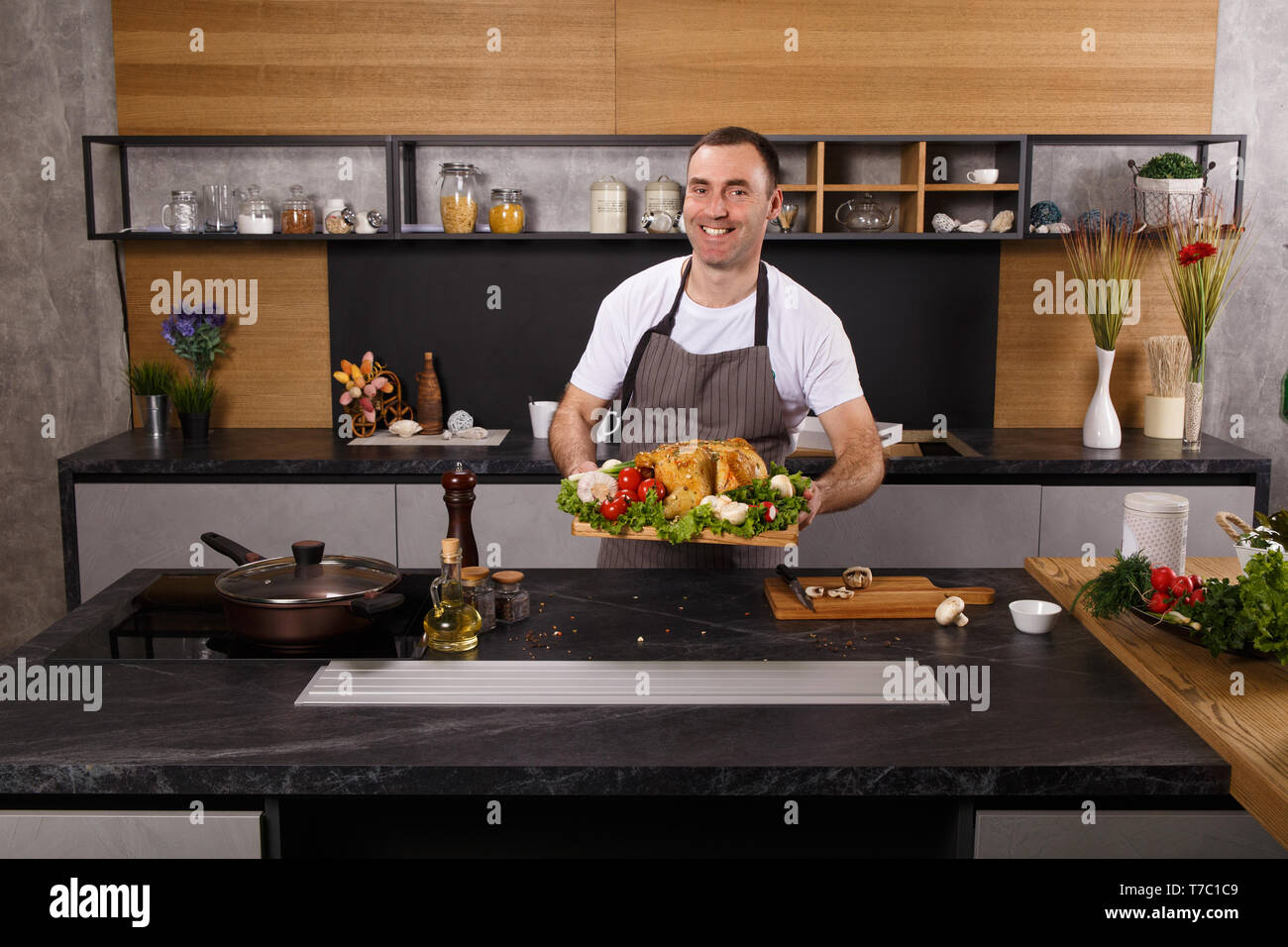 Portrait of handsome cook on the modern kitchen at home Stock Photo - Alamy